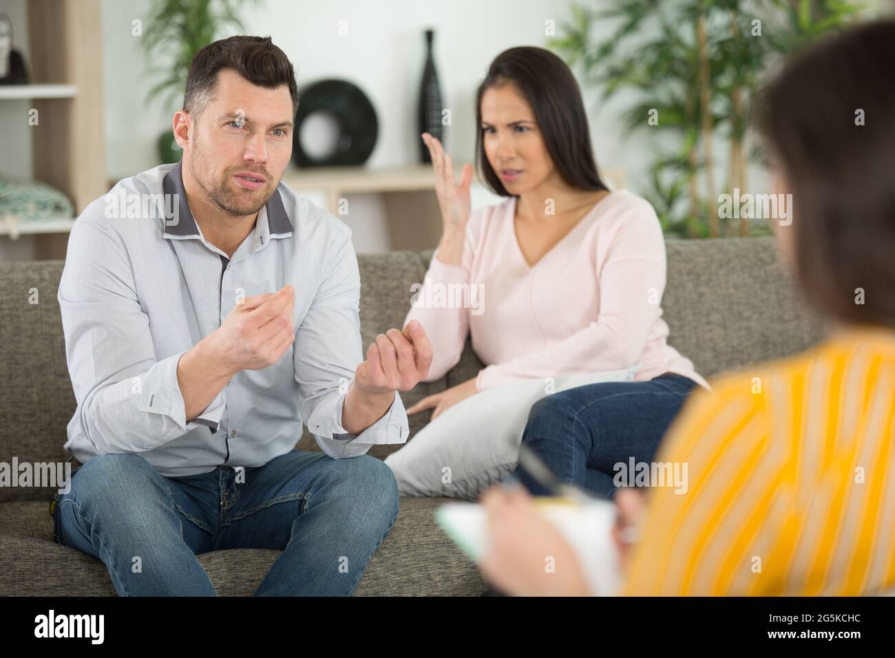 angry wife and sad husband during marriage psychotherapy with counselor ...