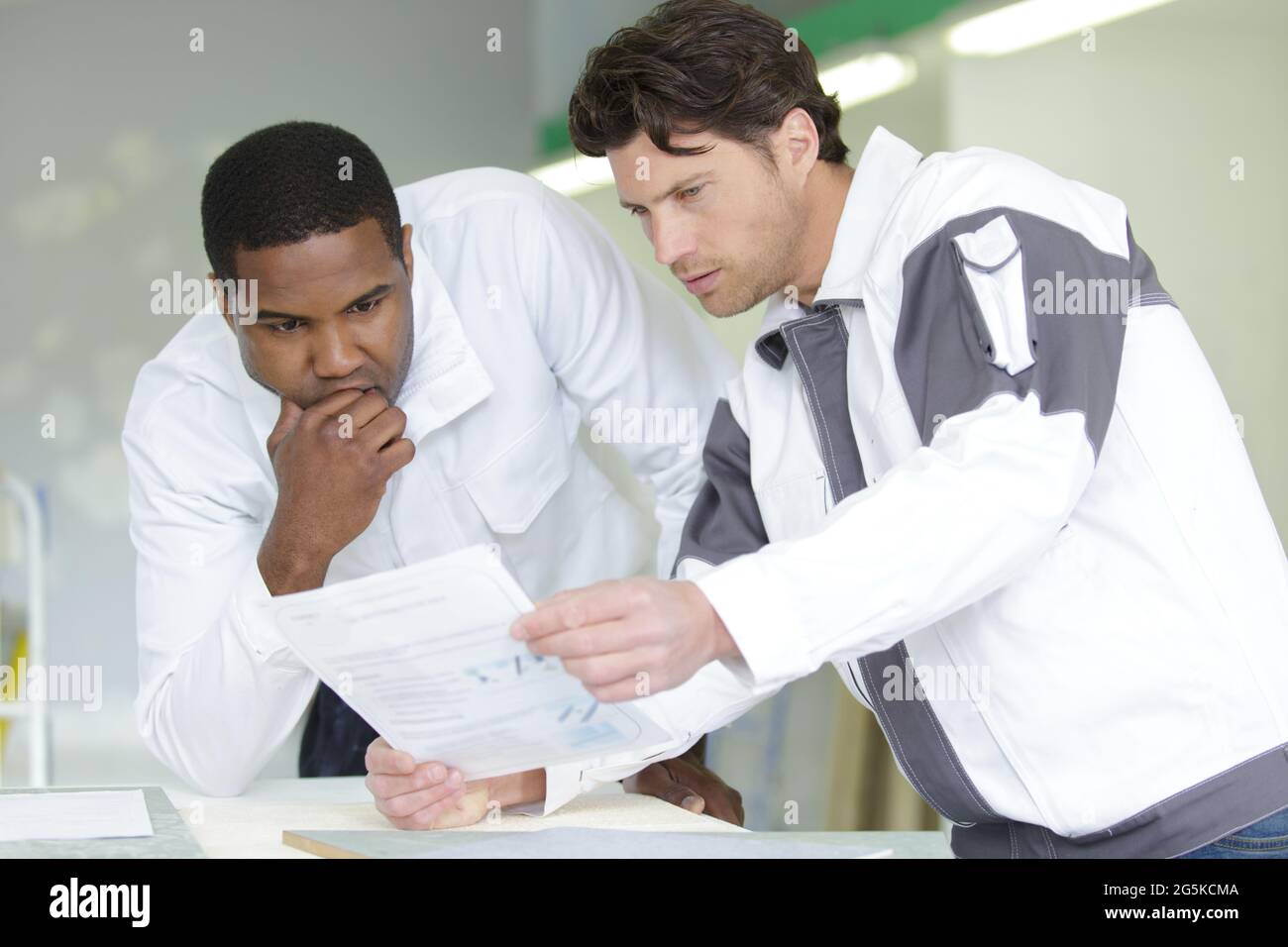 decorating team planning their job Stock Photo - Alamy
