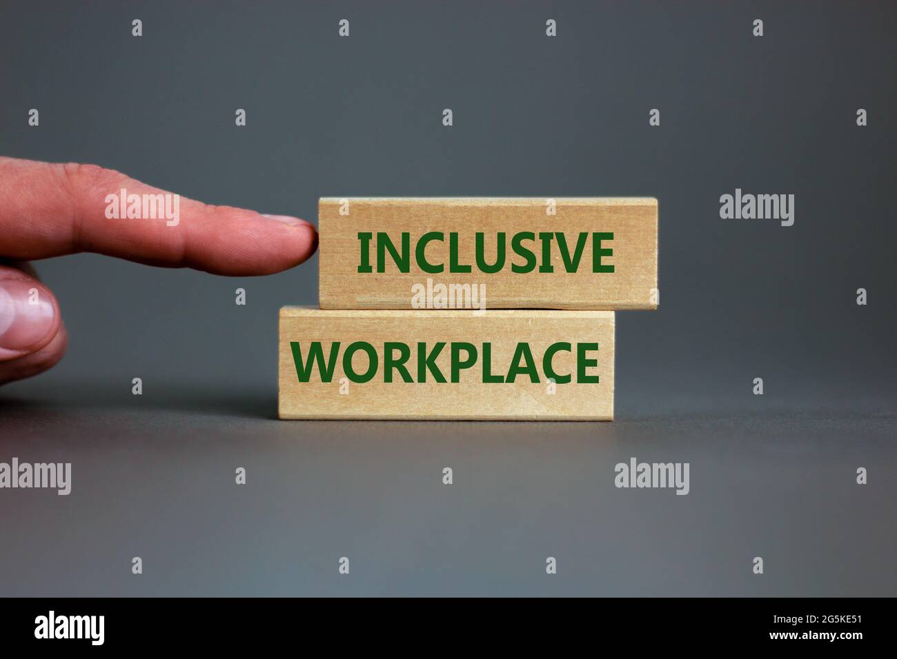 Inclusive workplace symbol. Wooden blocks with words Inclusive ...