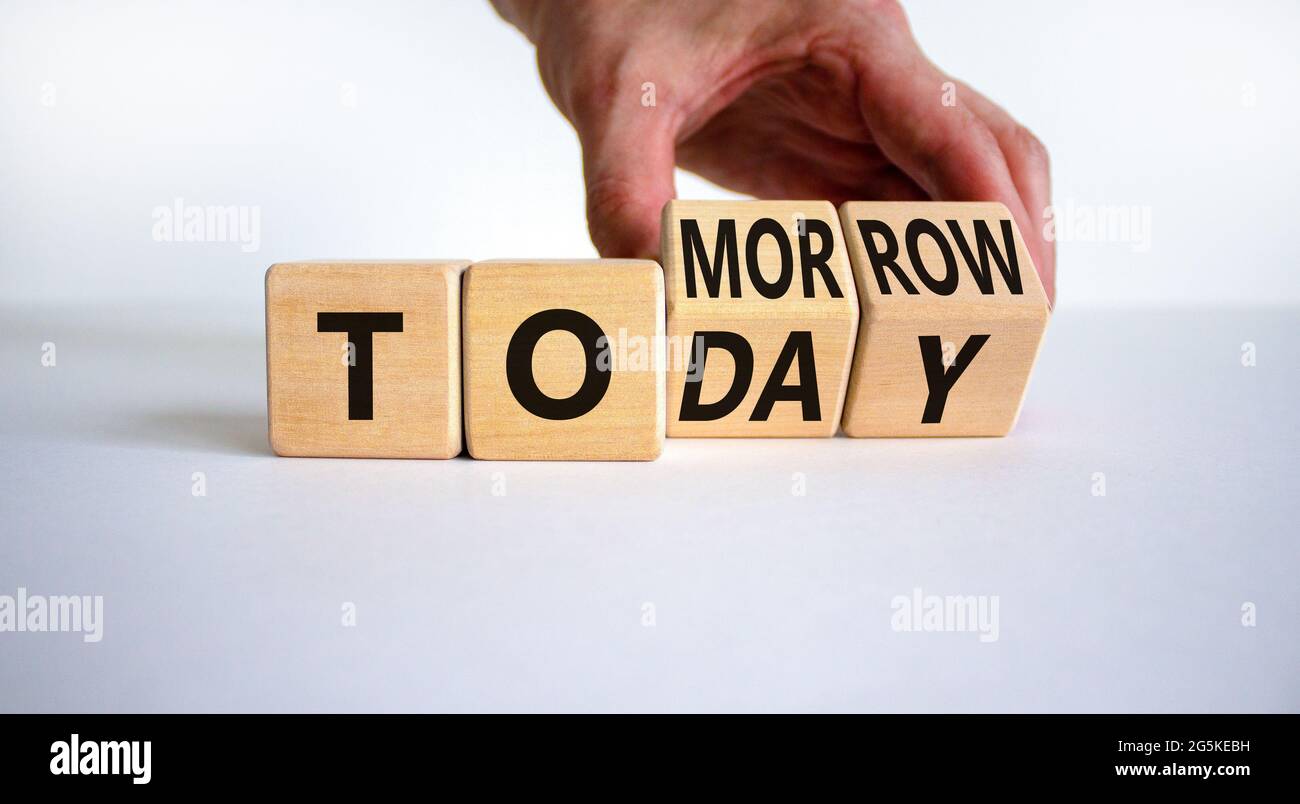 Do it today not tomorrow. Businessman turns wooden cubes and changes ...