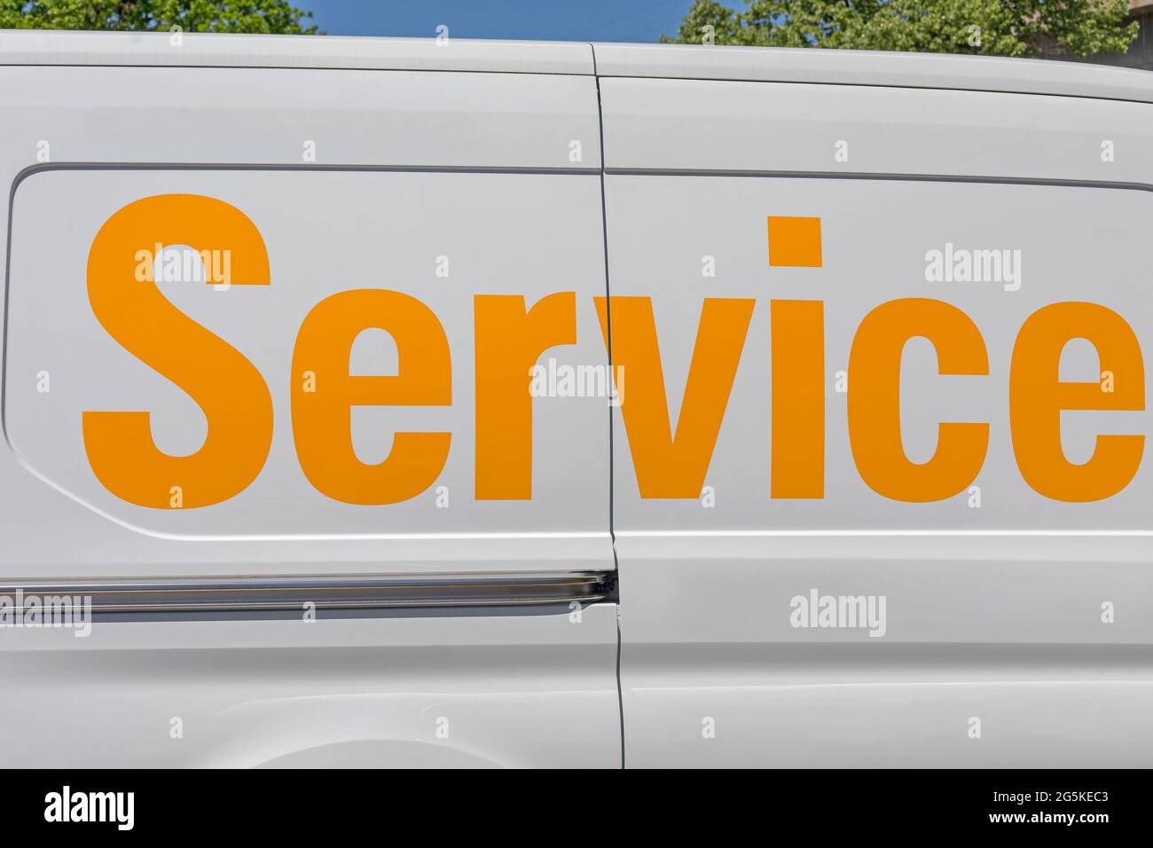 Big Yellow Sign Service at Vehicle Side Stock Photo - Alamy