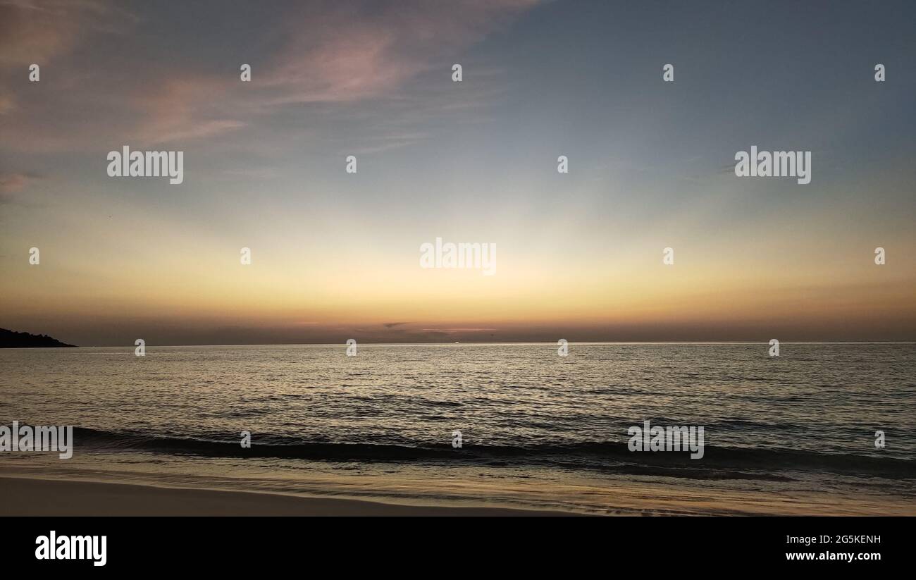 Beautiful shot of a calm sea under the evening sky Stock Photo - Alamy