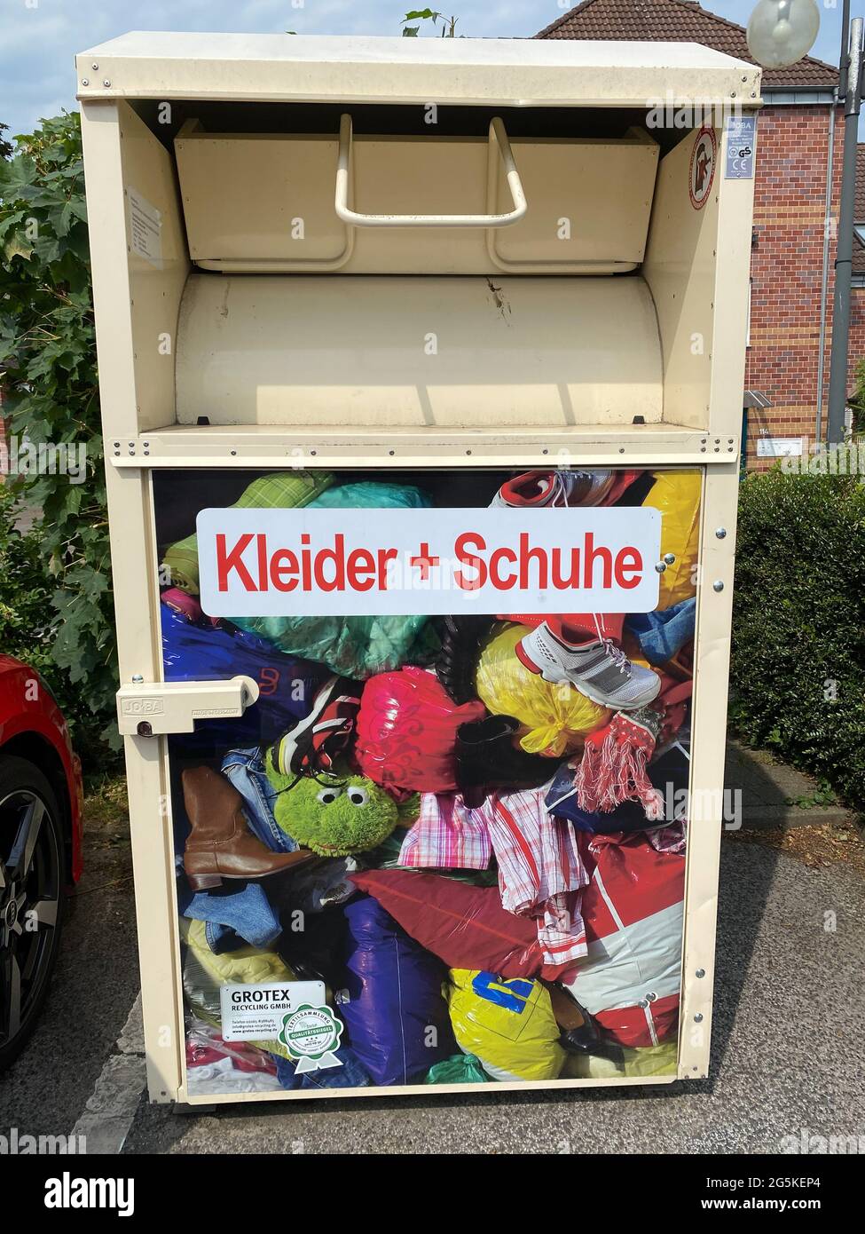 Old clothes collection container hi-res stock photography and images ...