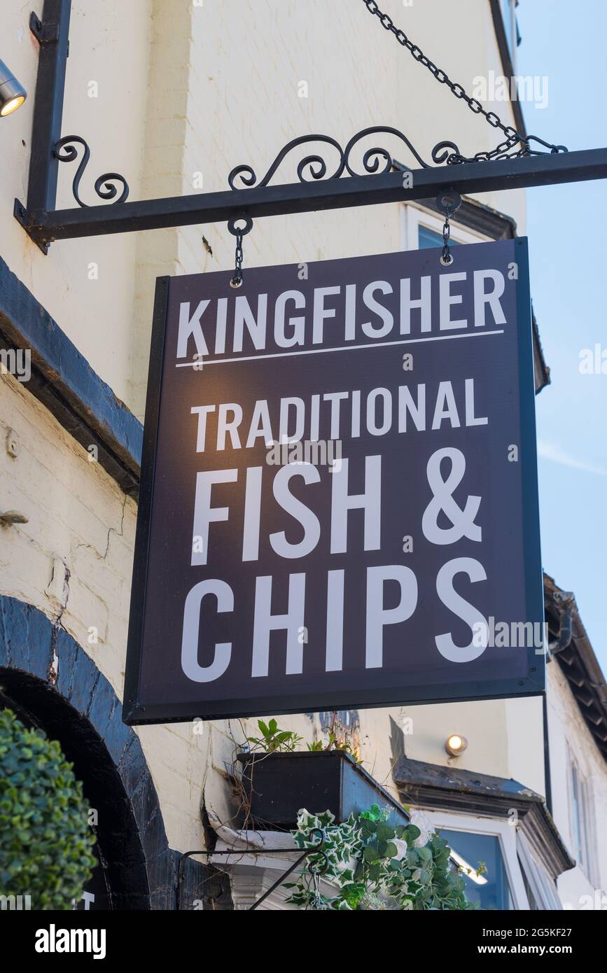 Old fashioned sign hanging outside Kingfisher traditional fish and ...
