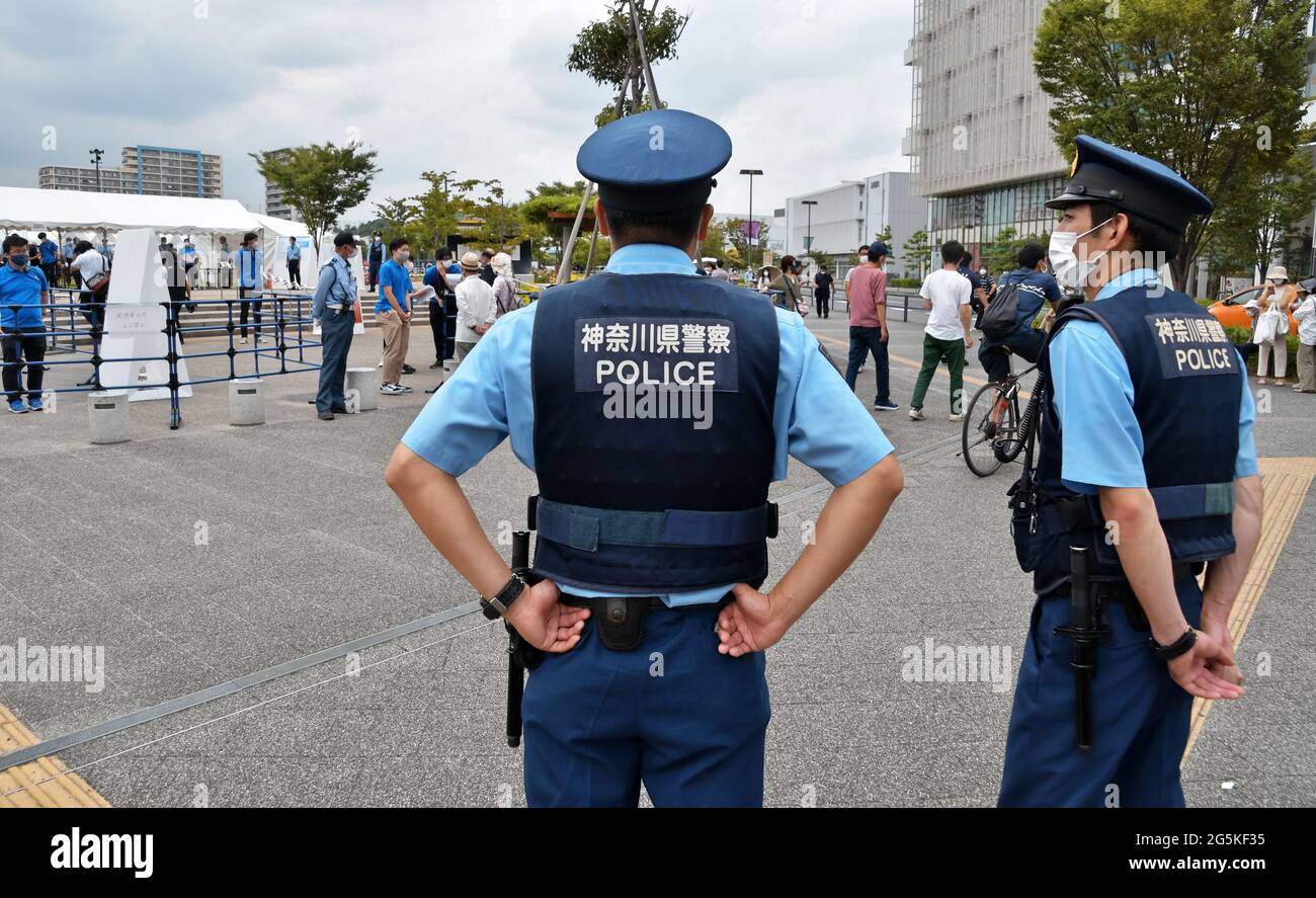 Fujisawa, Japan. 28th June, 2021. Police officers stand guard around ...