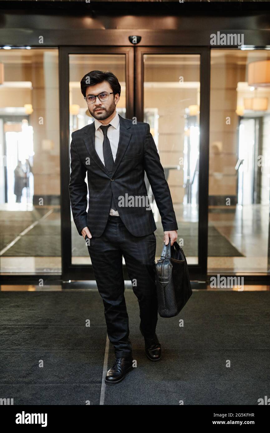 Vertical full length portrait of successful Middle-Eastern businessman ...