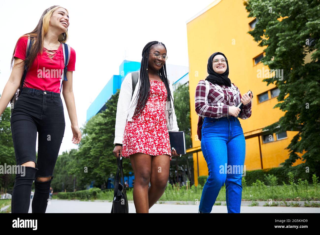 Young students walking around campus Stock Photo - Alamy