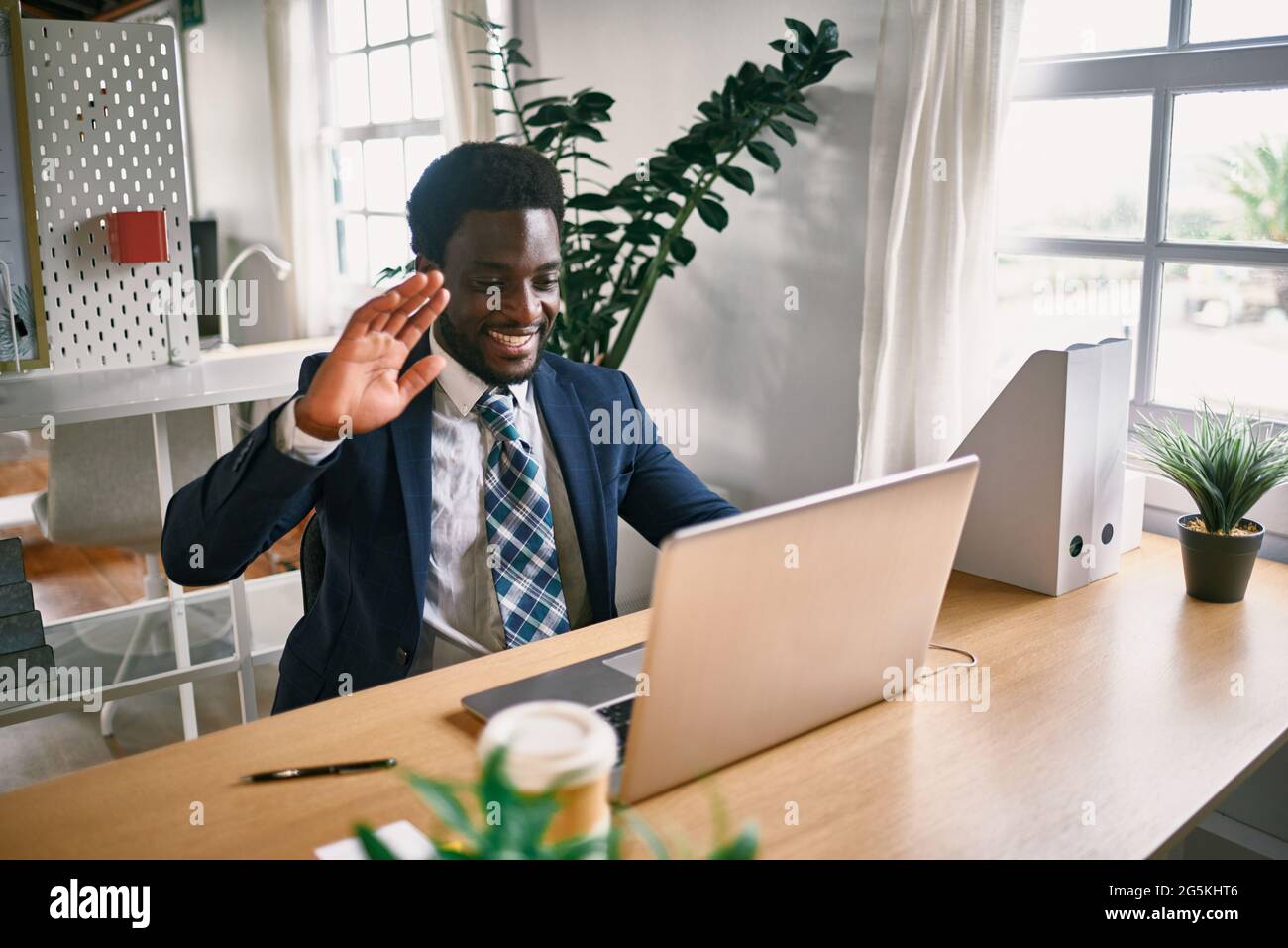 Young african man doing video call conference inside modern office ...