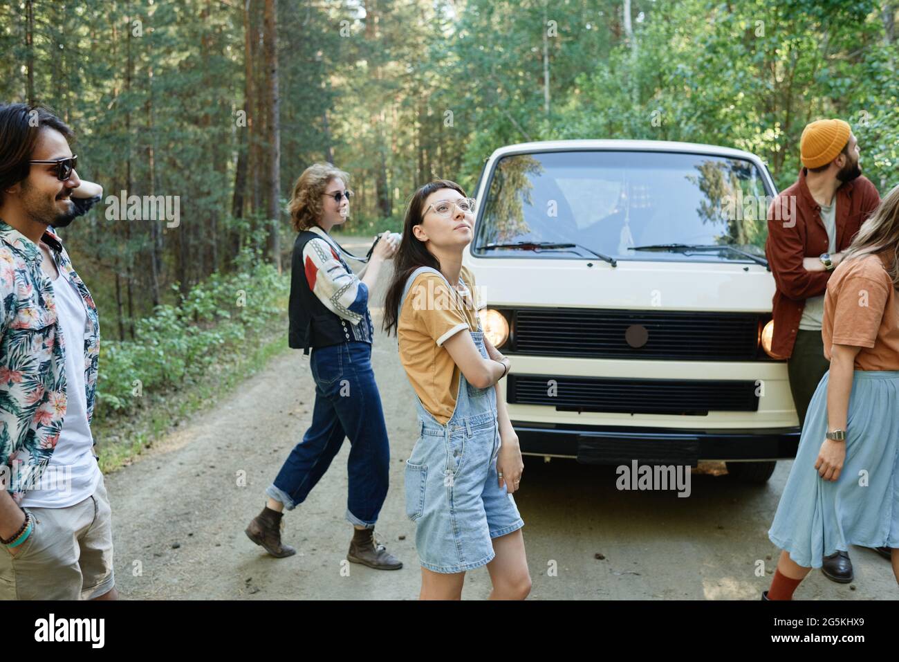 Young people looking around in the forest they going here by van Stock ...