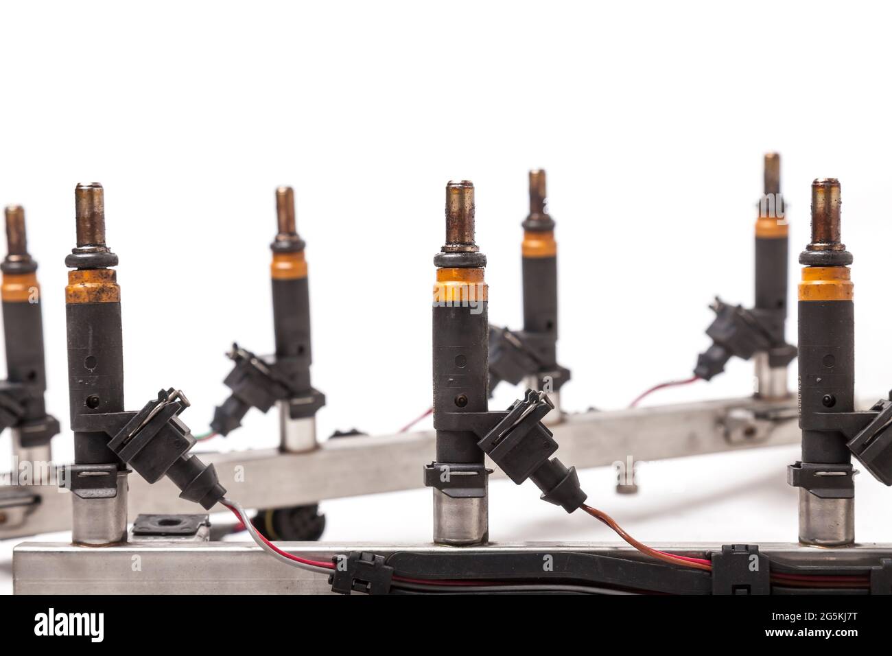 Close-up on a car fuel rail with injectors for supplying gasoline to ...