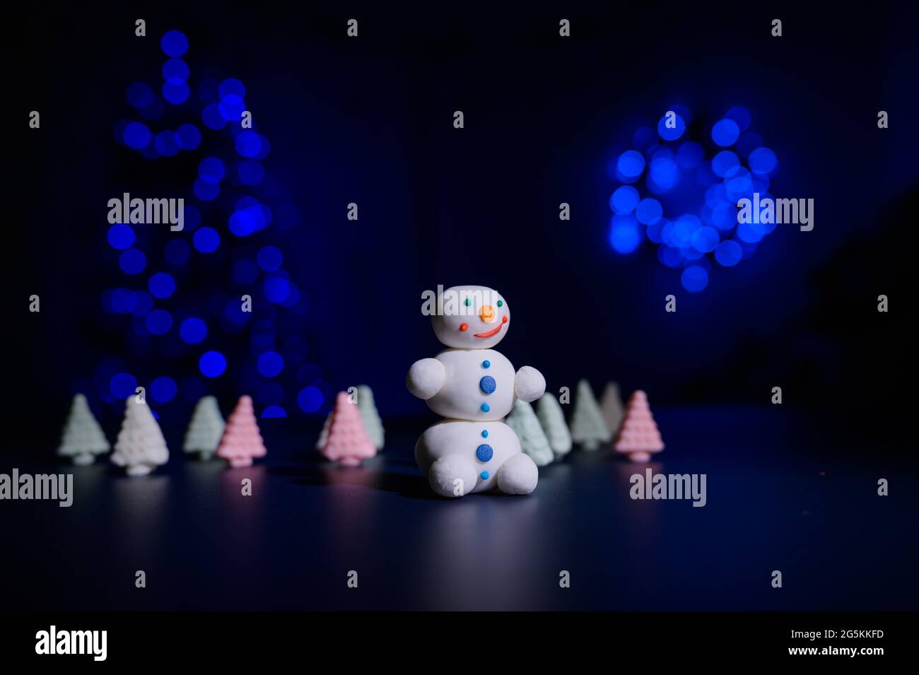Cute snowman and little Christmas trees made of marshmallows on the ...