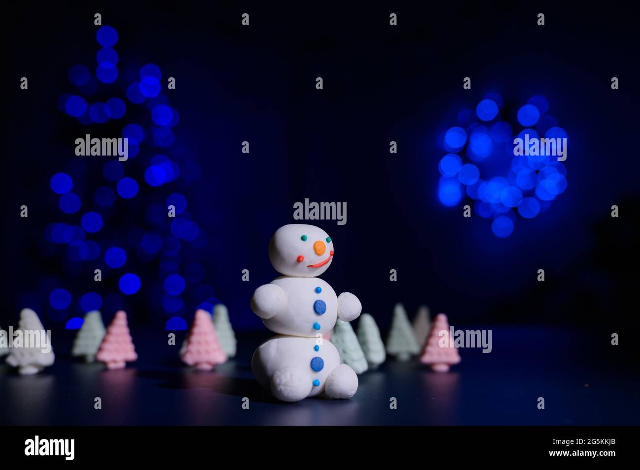 Cute snowman and little Christmas trees made of marshmallows on the ...