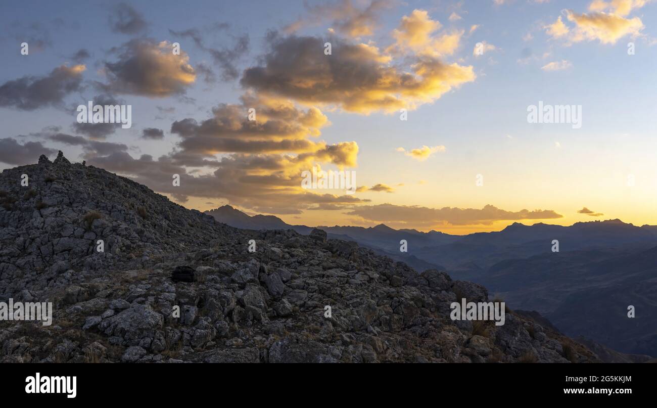 Sunset clouds at the top of a viewpoint located in Huancavelica, Peru ...