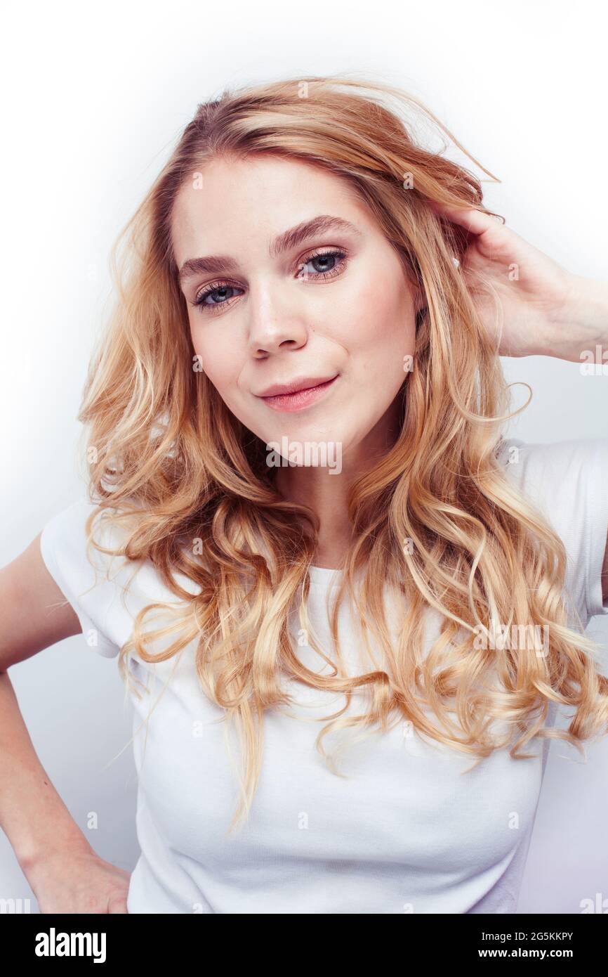 young pretty stylish blond hipster girl posing emotional isolated on ...