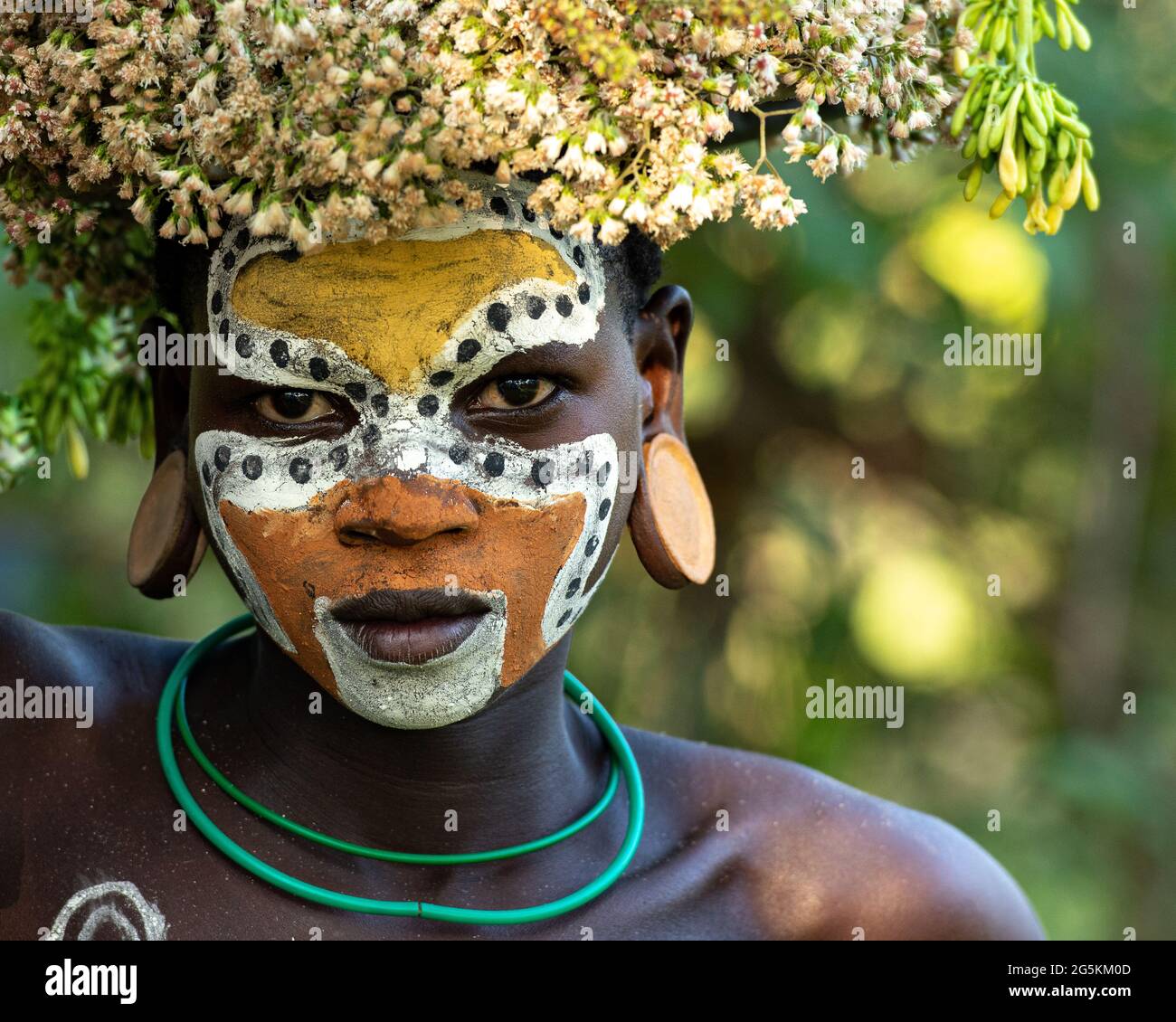 The face-paint of the Suri tribe is thought to be a sign of strength ...
