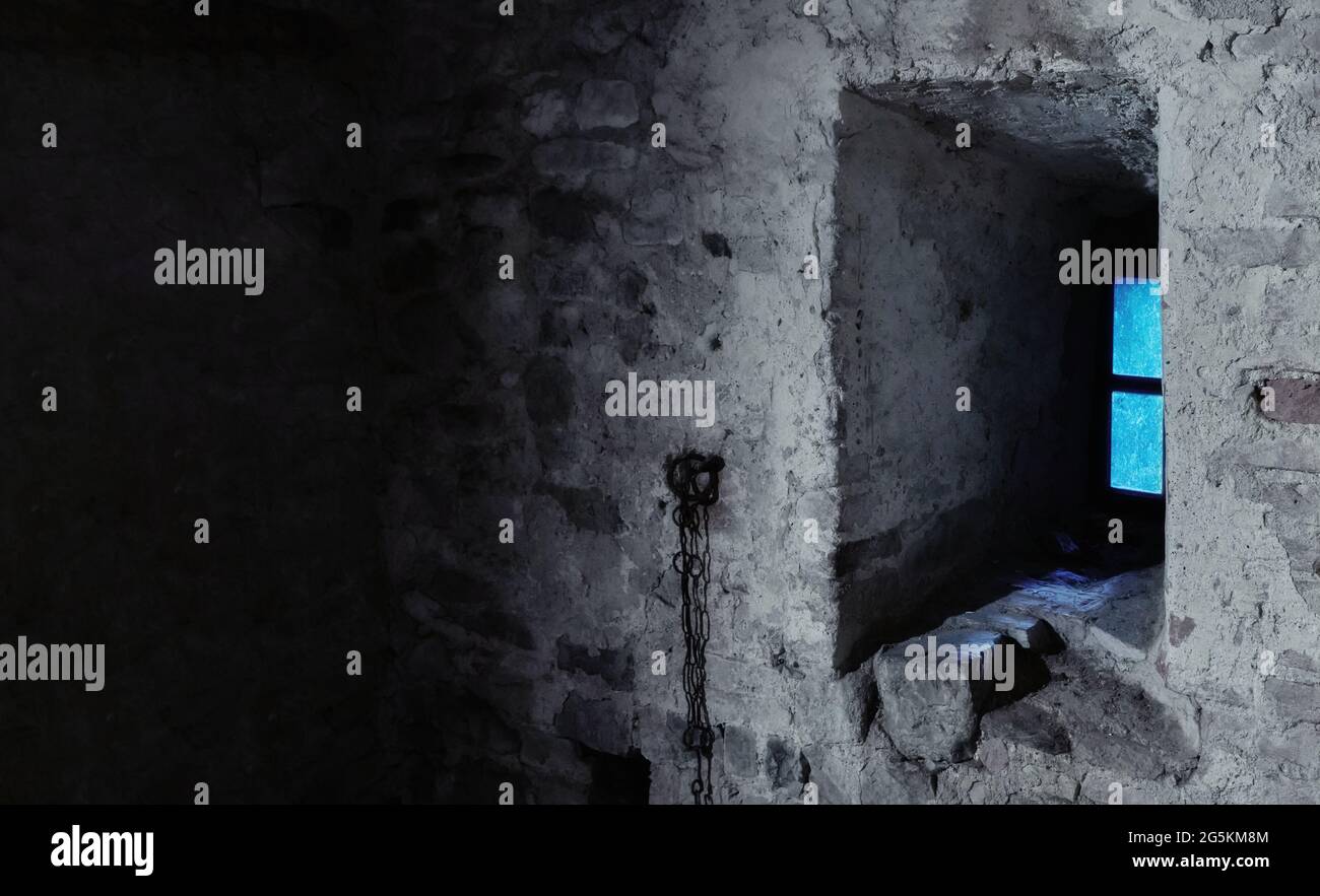 interior view of medieval old prison with chain and window - searching ...