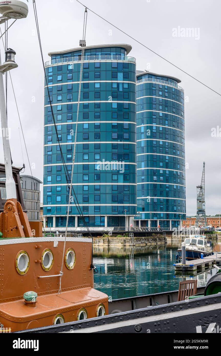 The Quays residential tower blocks with the tugboat MT Kent moored in ...