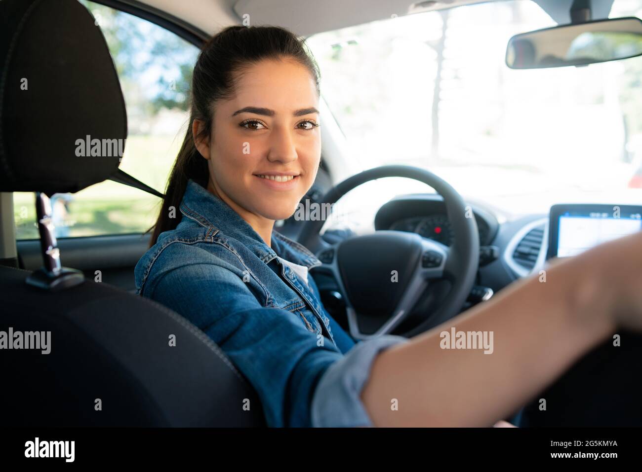 Woman driving her car Stock Photo - Alamy