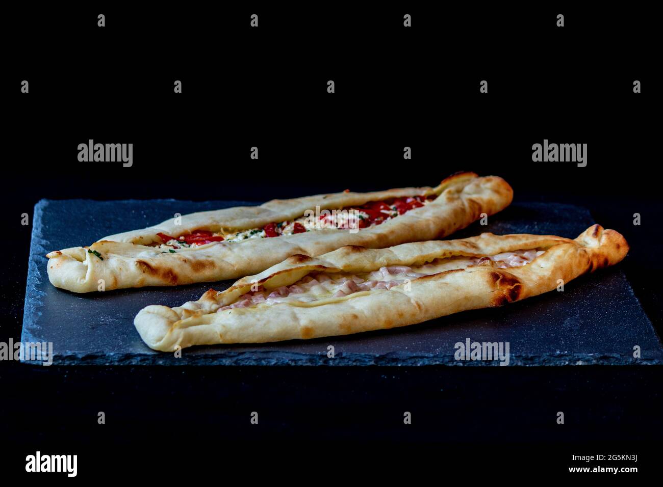 Closeup shot of delicious flatbread pockets with different fillings ...