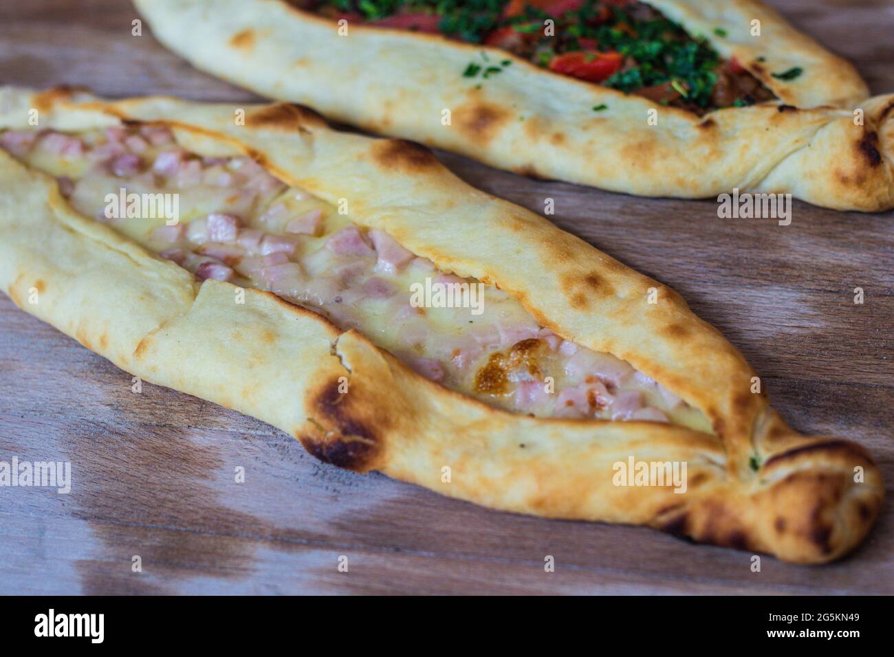 Closeup shot of delicious flatbread pockets with different fillings ...