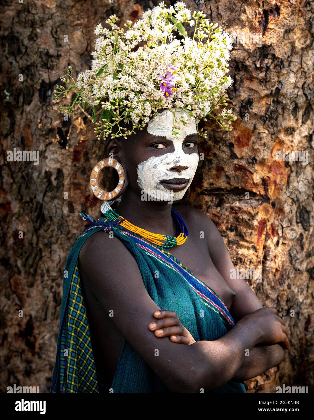 Delicate white flowers appear to grow out of this lush headdress. OMO ...