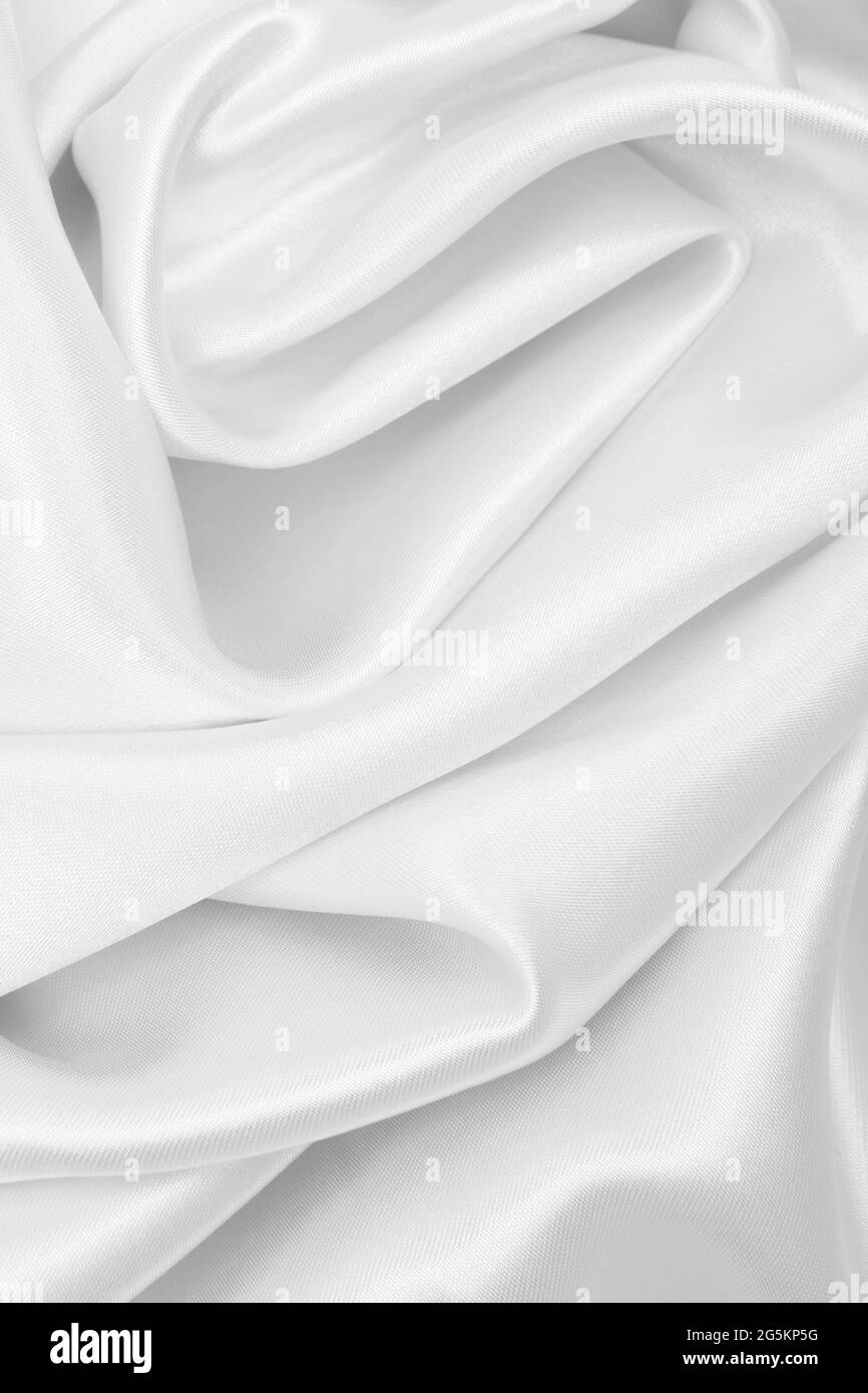 Smooth elegant white silk or satin luxury cloth texture can use as ...