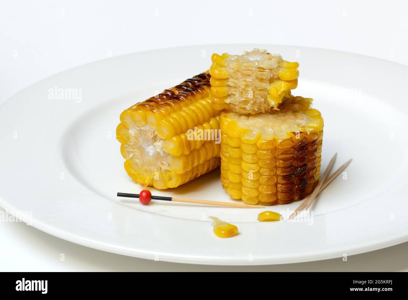Grilled corn on the corn cob, cut up, on plate, Germany, Europe Stock ...