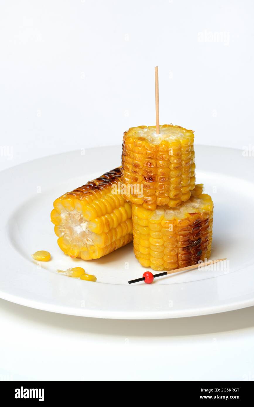Grilled corn on the corn cob, cut up, on plate, Germany, Europe Stock ...