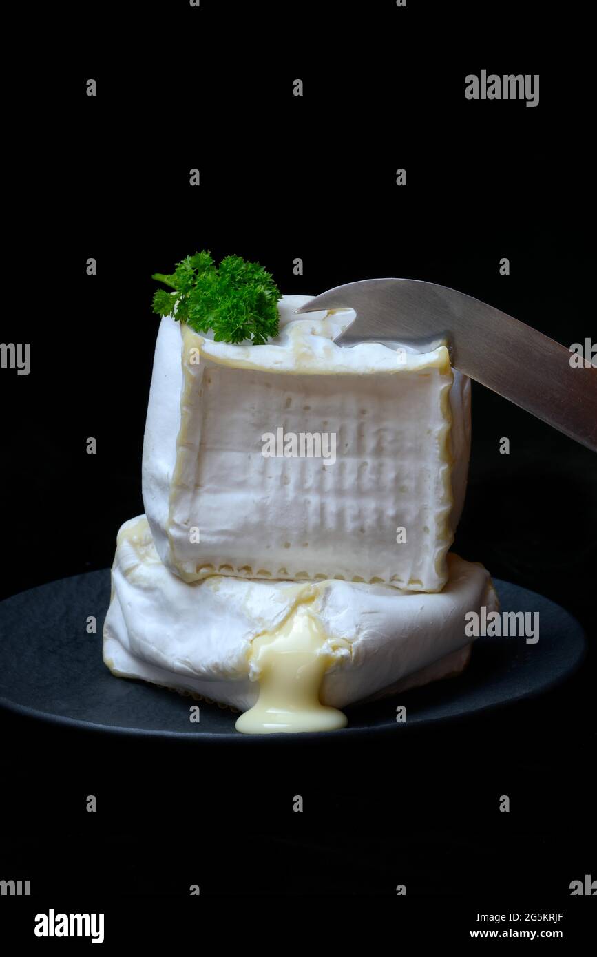 French soft cheese, Pavé d'Affinois, with cheese knife Stock Photo - Alamy