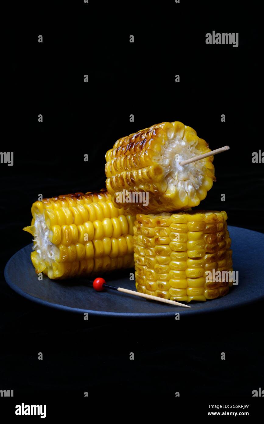 Grilled corn on the corn cob, cut up, on plate, Germany, Europe Stock ...