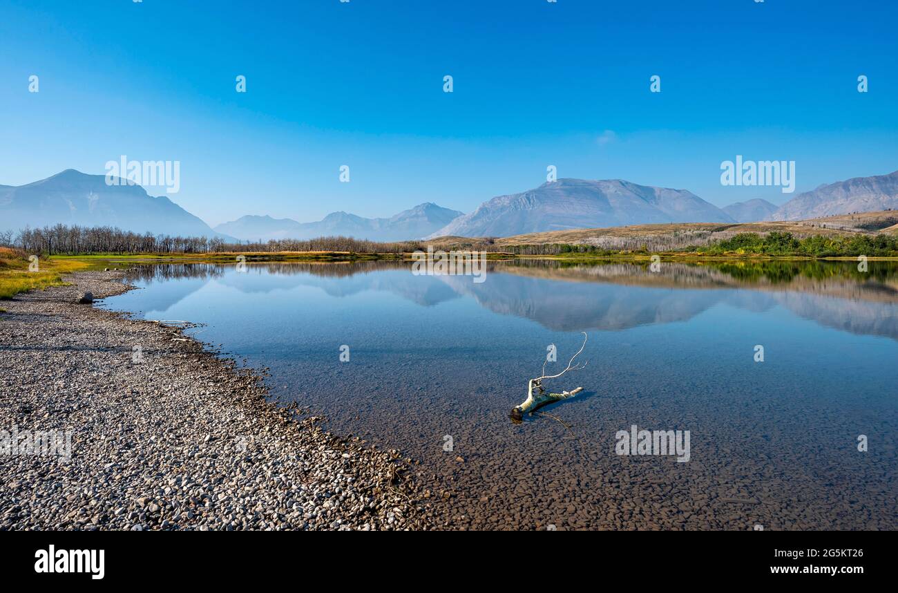 Mountains reflected in the lake, Maskinonge Lake, Waterton Lakes ...