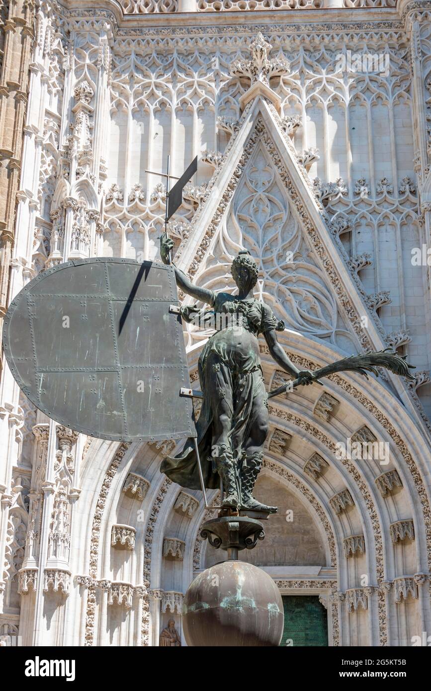 Bronze statue Giraldillo in front of the main entrance, Seville ...
