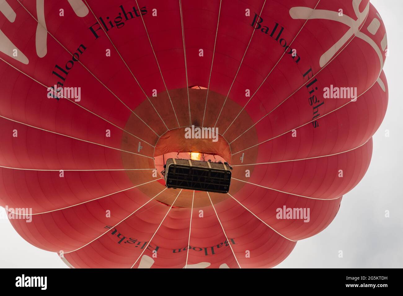 Red hot-air balloon from below Stock Photo - Alamy