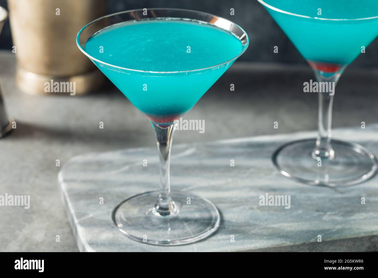 Boozy Refreshing Blue Martini Cocktail with Cherry Garnish Stock Photo ...