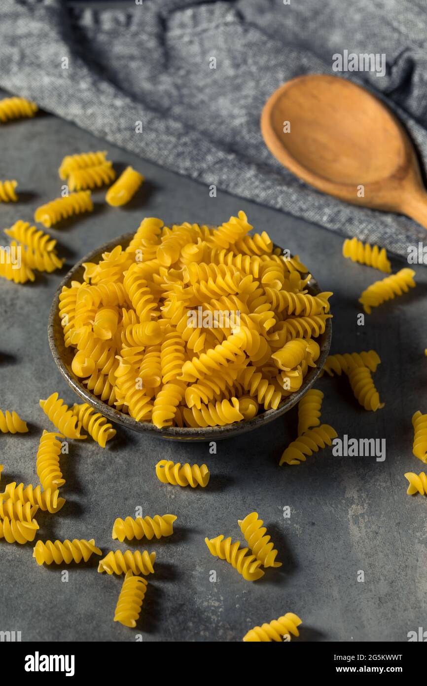 Dry Yellow Organic Rotini Pasta in a Bowl Stock Photo - Alamy