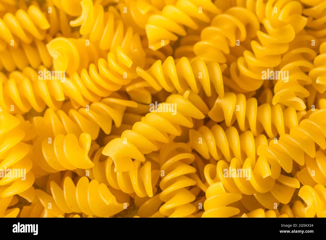 Dry Yellow Organic Rotini Pasta in a Bowl Stock Photo - Alamy