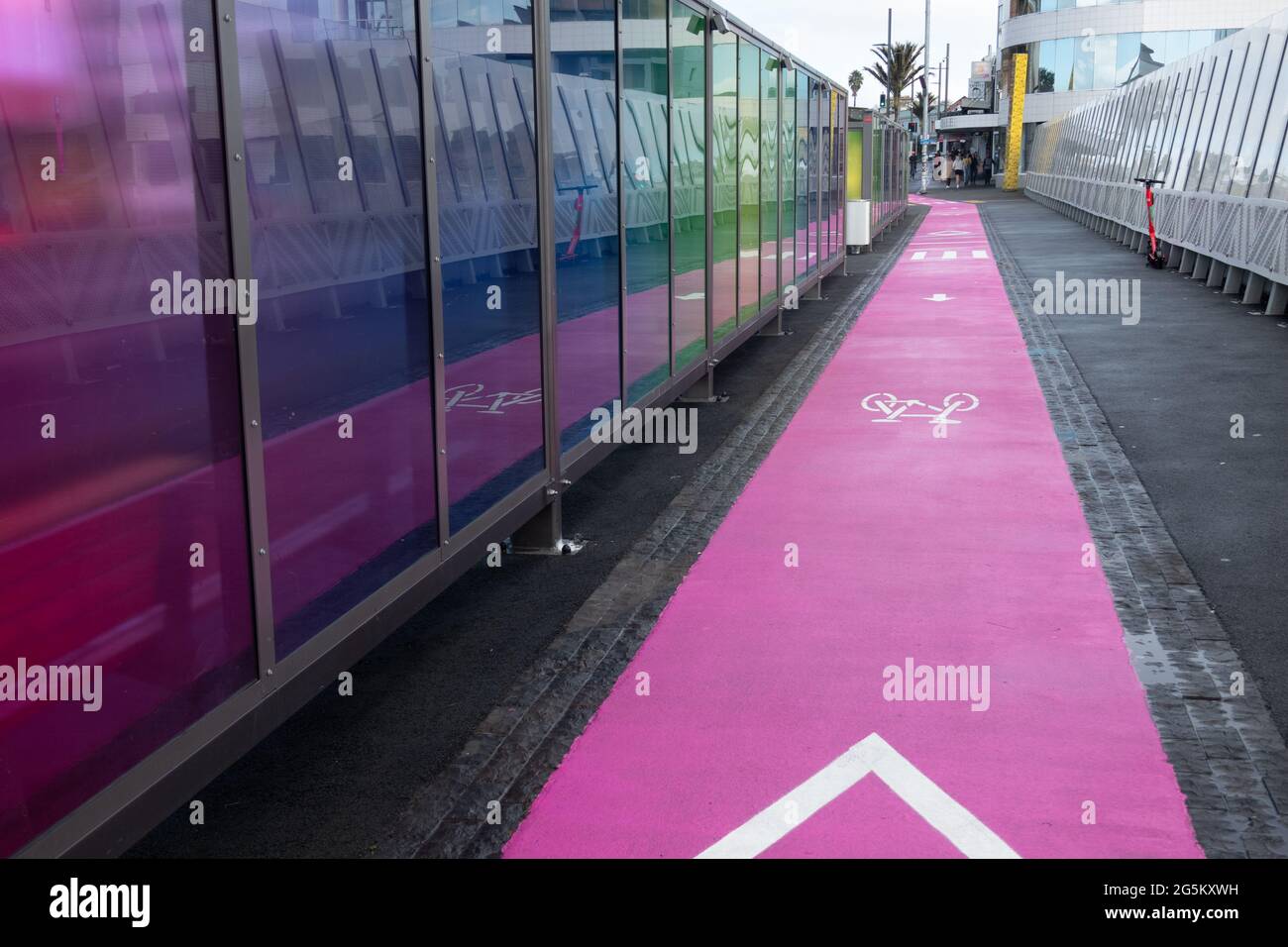 Auckland New zealand - June 19 2021; Pink cycle lane on footpath ...
