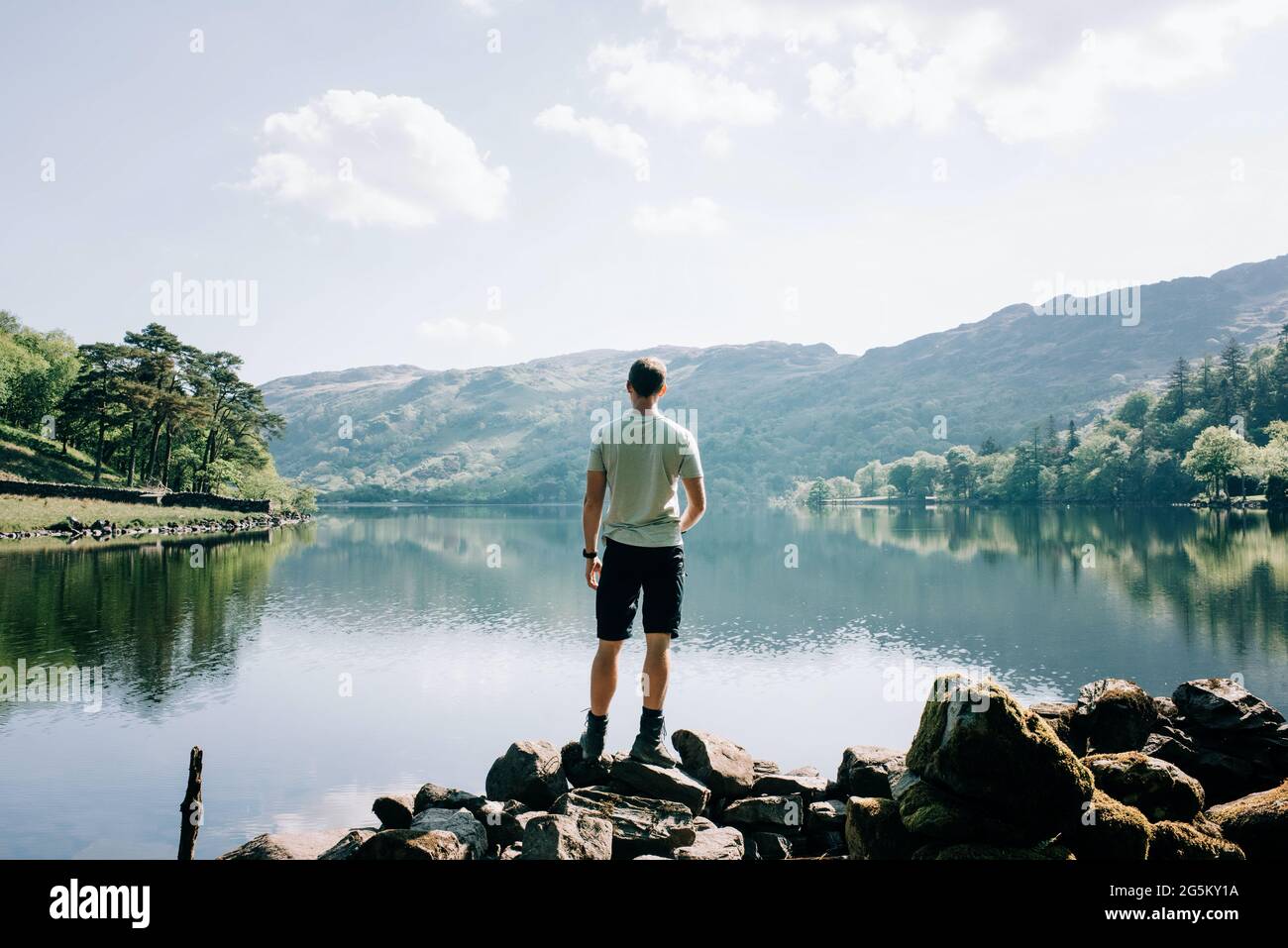 man enjoying the view of the Welsh mountains and lakes in the UK Stock ...