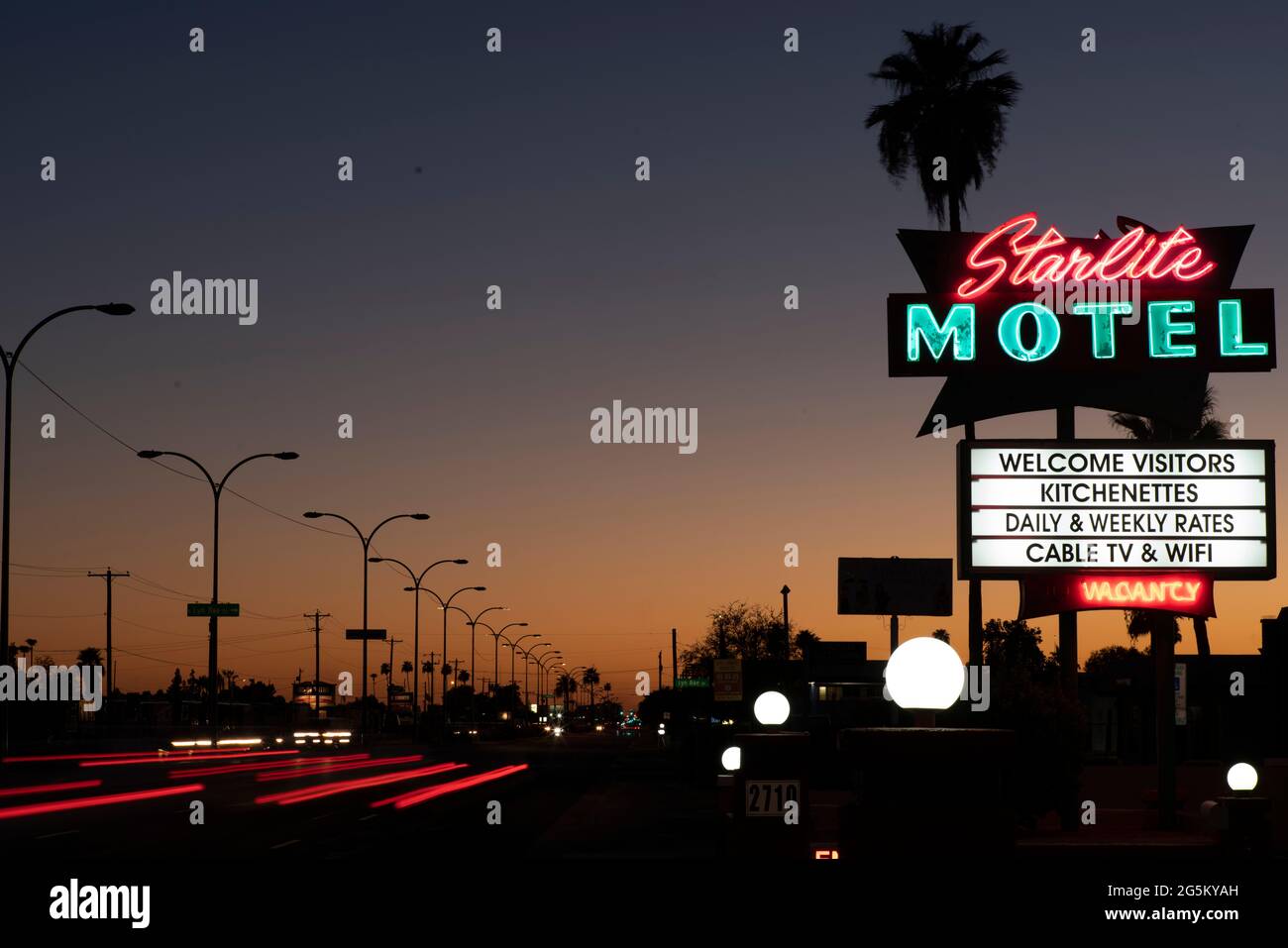The Starlite Motel in AZ at sunset with light trails from passing cars ...