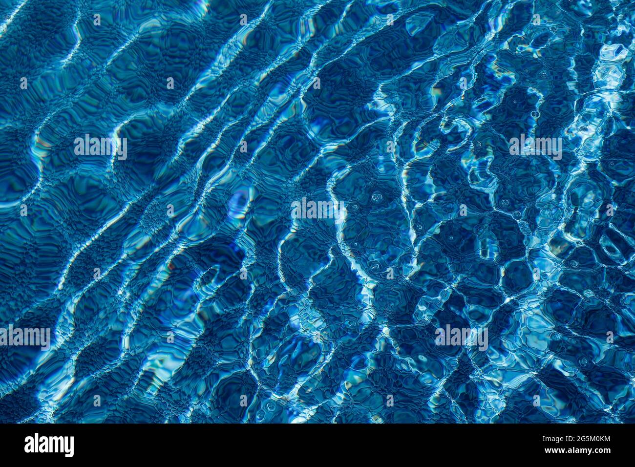 Water surface with reflections over stony ground, pattern, background ...