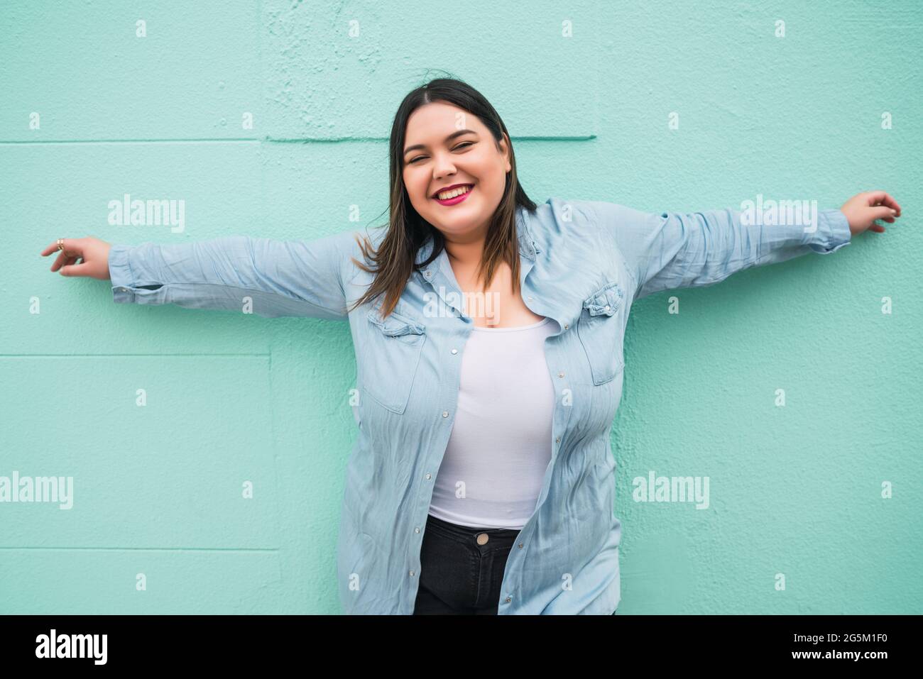 Portrait of young plus size woman Stock Photo - Alamy