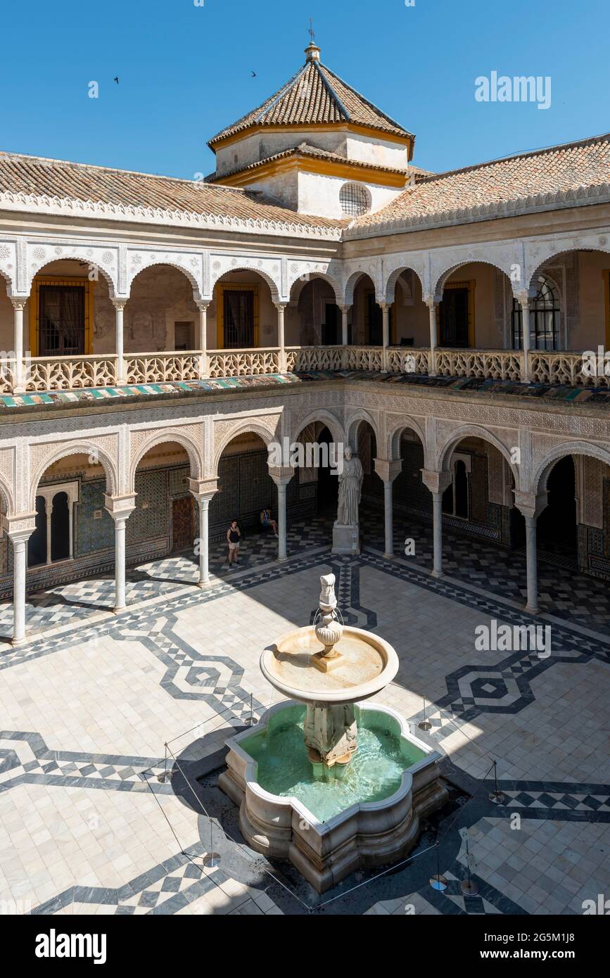 Inner courtyard with archways and fountain, Moorish architecture, city ...