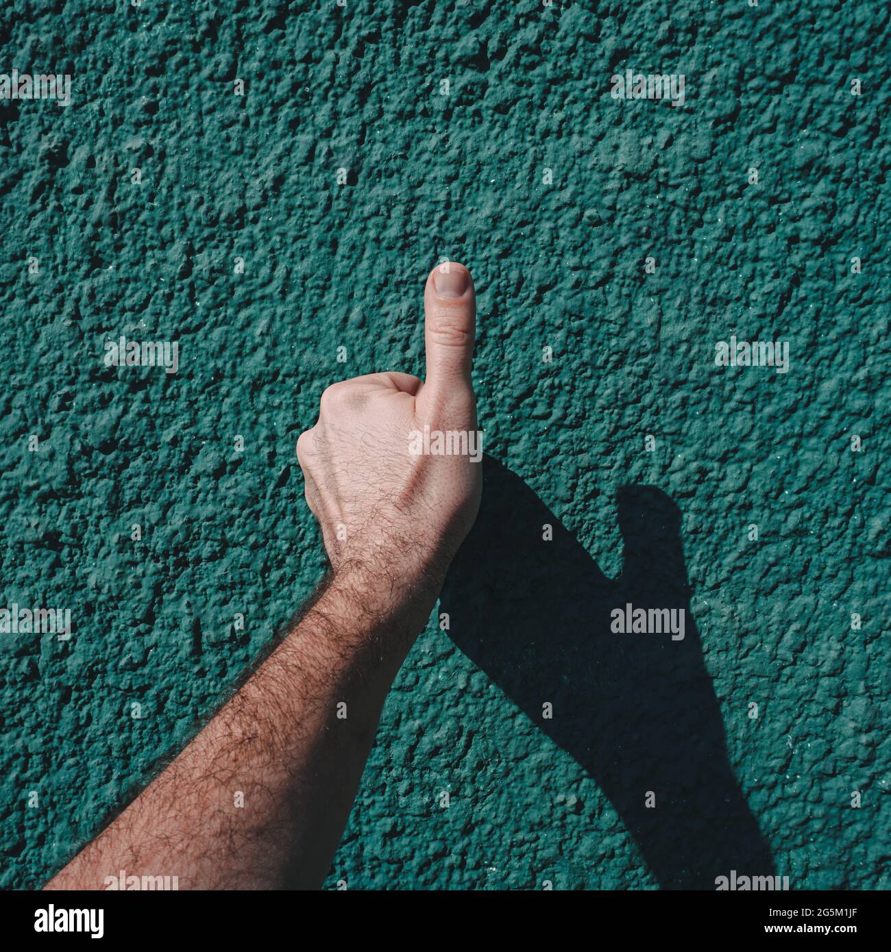 hand with thumb up gesturing on the green wall Stock Photo - Alamy hand with thumb up gesturing on the green wall Stock Photo - Alamy
