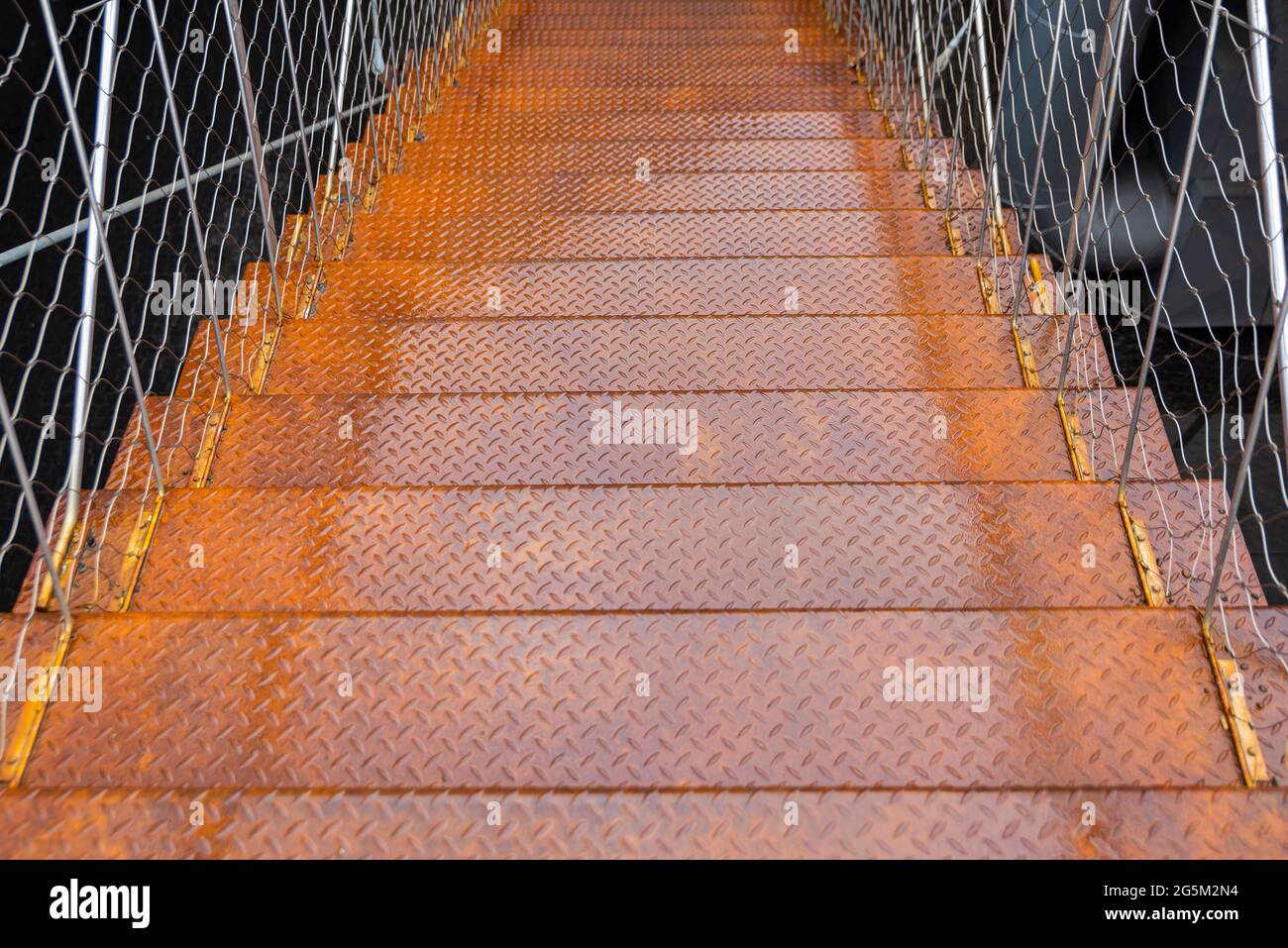 rusty wet metal staircase leading down, stairs down to darkness, fear ...
