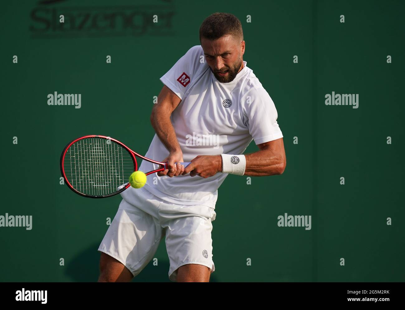 Liam Broady in action against Marco Cecchinato on day one of Wimbledon ...