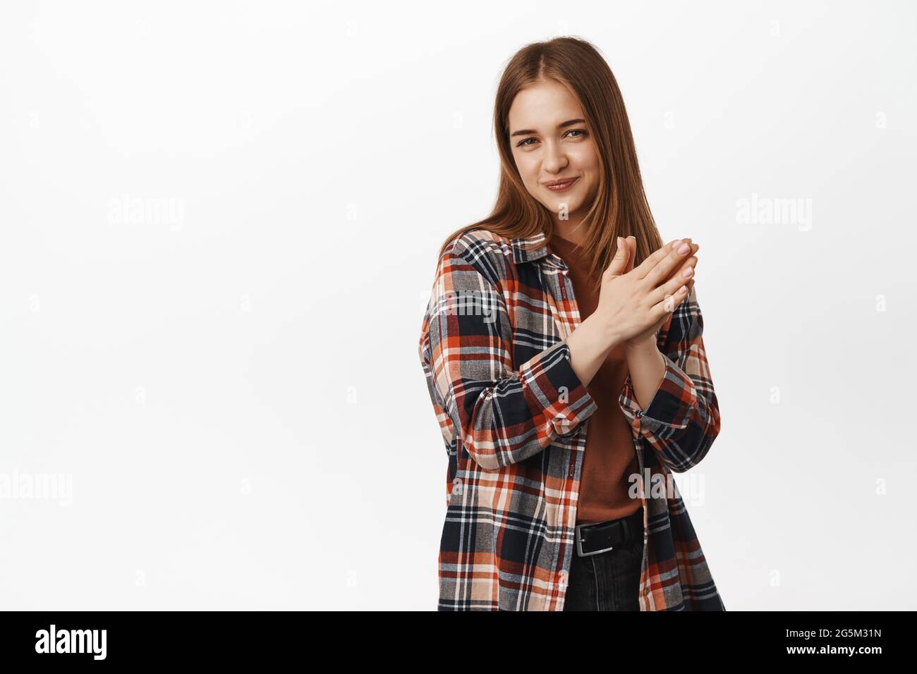 Cunning young woman has plan, rub hands and smirk devious, planning ...