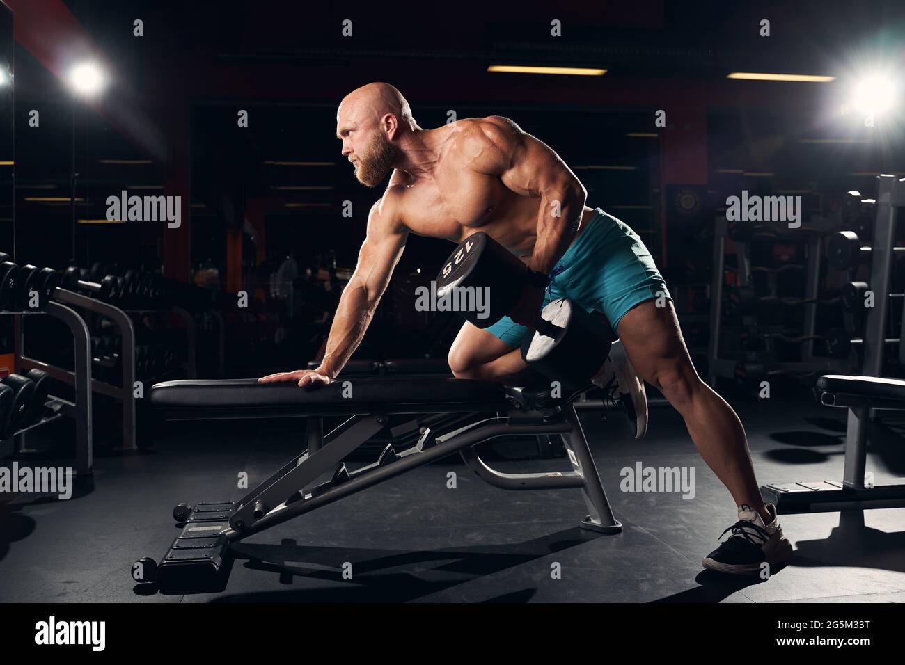 Sporty bald man working out in the gym Stock Photo - Alamy