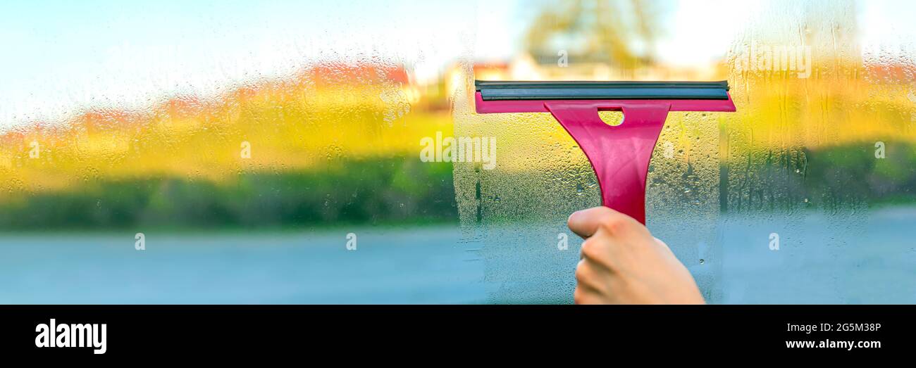 House cleaning. Washing dirty window panes with detergent. wash window ...