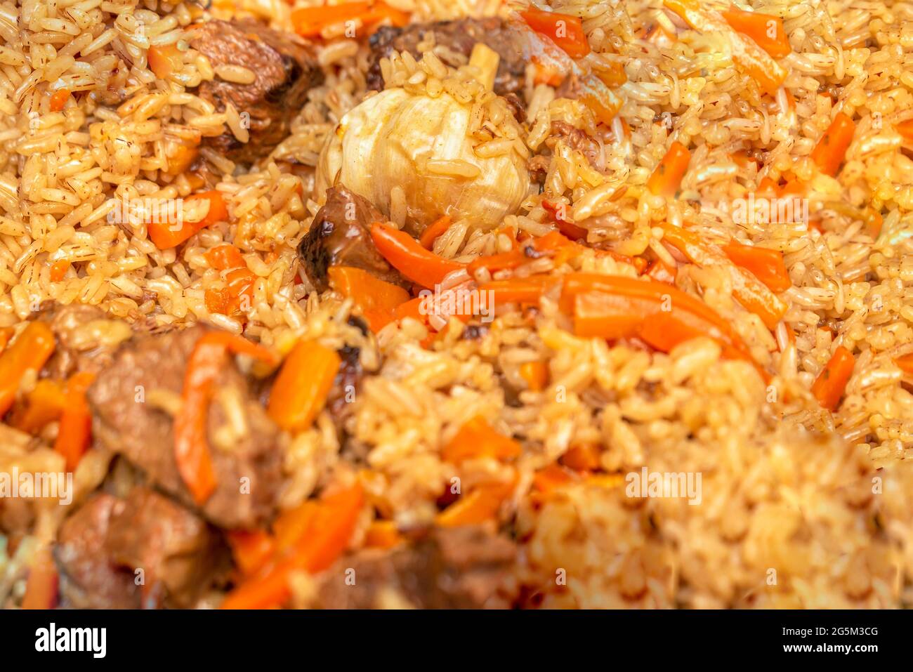Pilaf close-up. Oriental cuisine concept. National Uzbek pilaf with ...