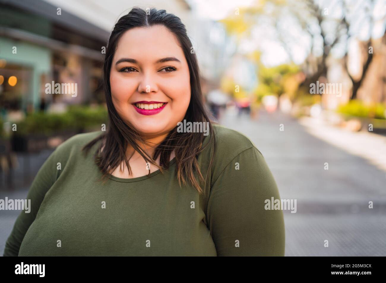 Portrait of young plus size woman Stock Photo - Alamy